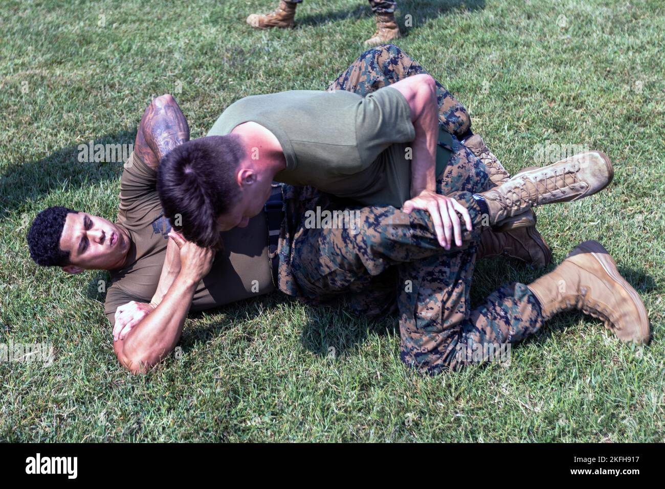 U.S. Marine Corps Sgt. Jeromy Rodrigues and Cpl. Dylan Coombs grapple ...