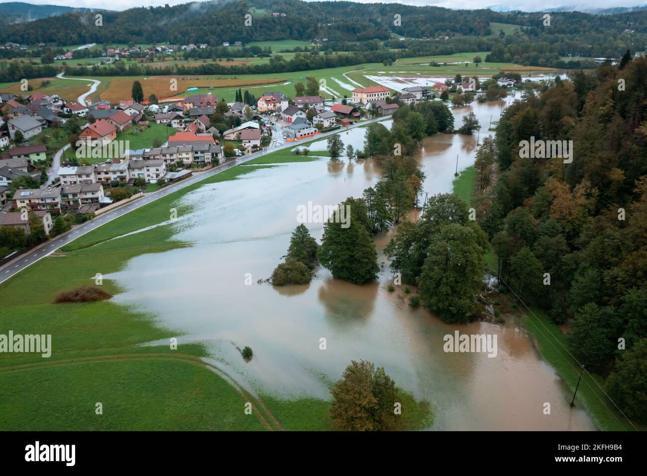Heavy rainfall causing flooding, water moving slowly across river ...