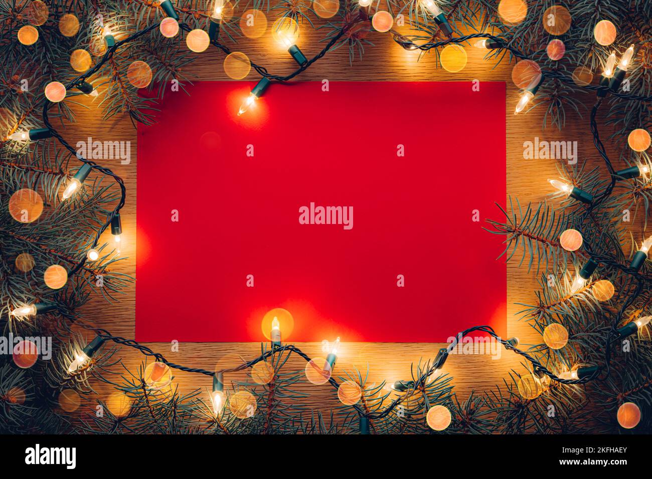 Red paper letter background with Christmas tree branches and Christmas ...