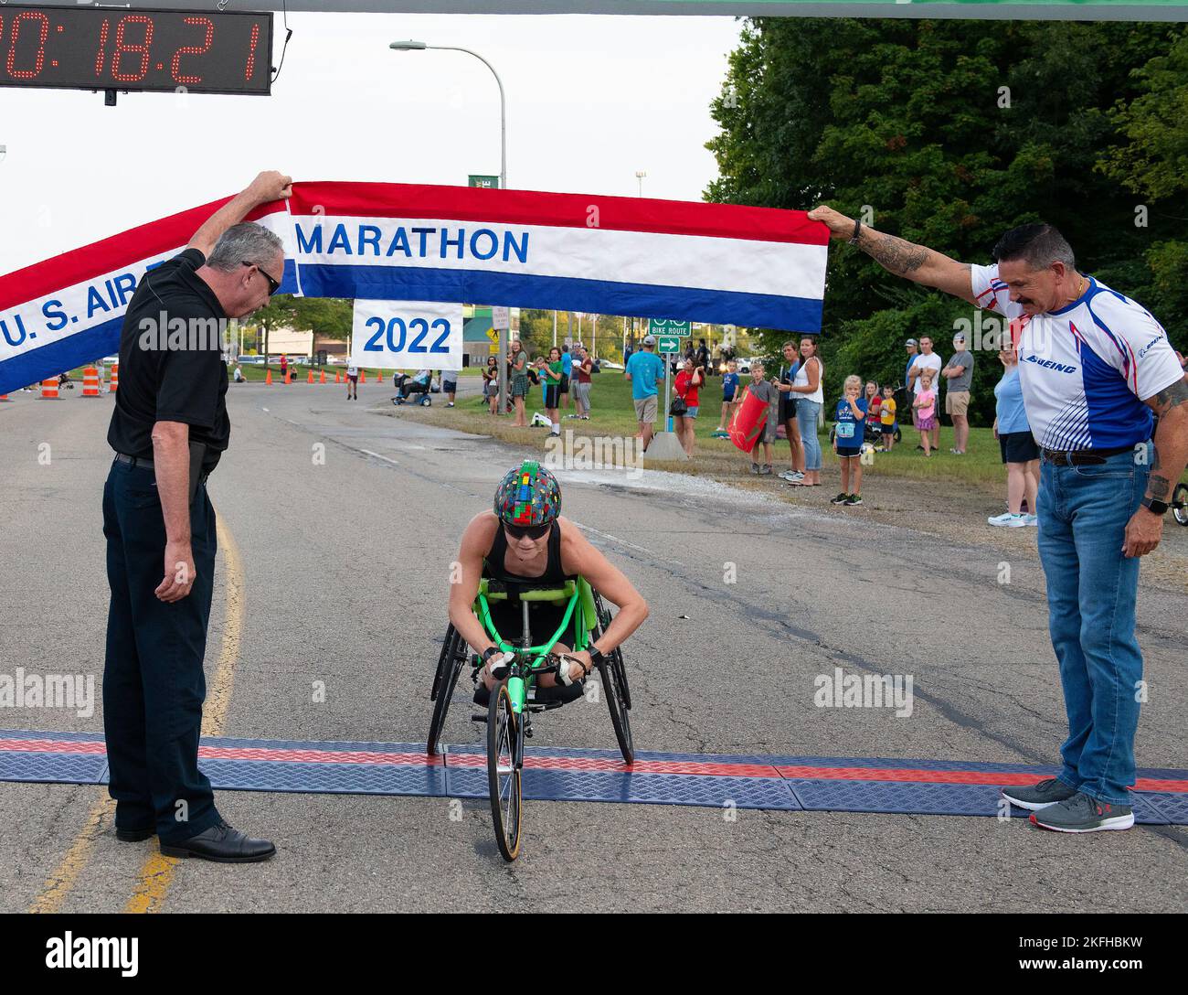 The wheeled winner of the cycle five-kilometer race pedals under the ...