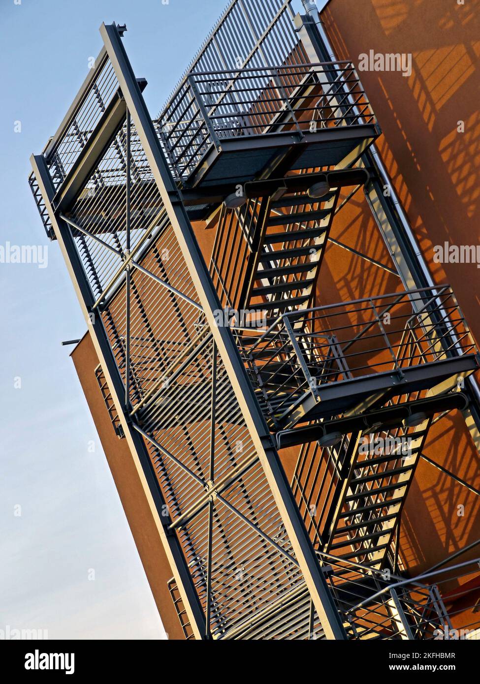 Steel emergency stairs on an orange commercial building Stock Photo - Alamy