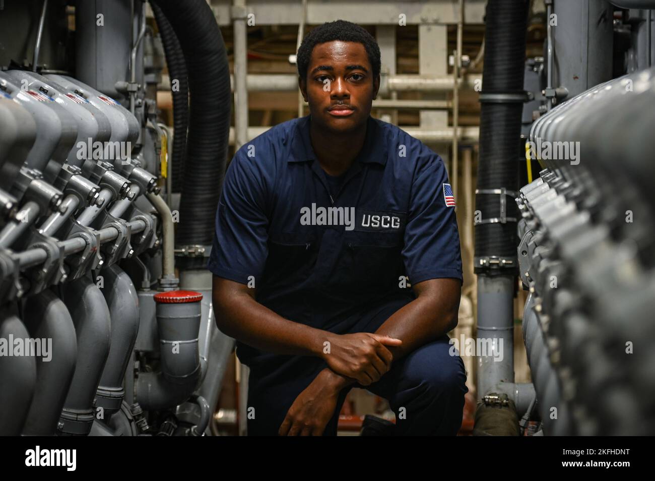Coast Guard Fireman Anthony Quartey poses on the Coast Guard Cutter ...