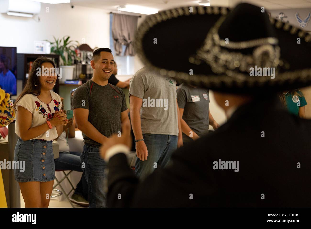 Attendees of Hispanic Heritage Month participate in a “La Raspa” group ...