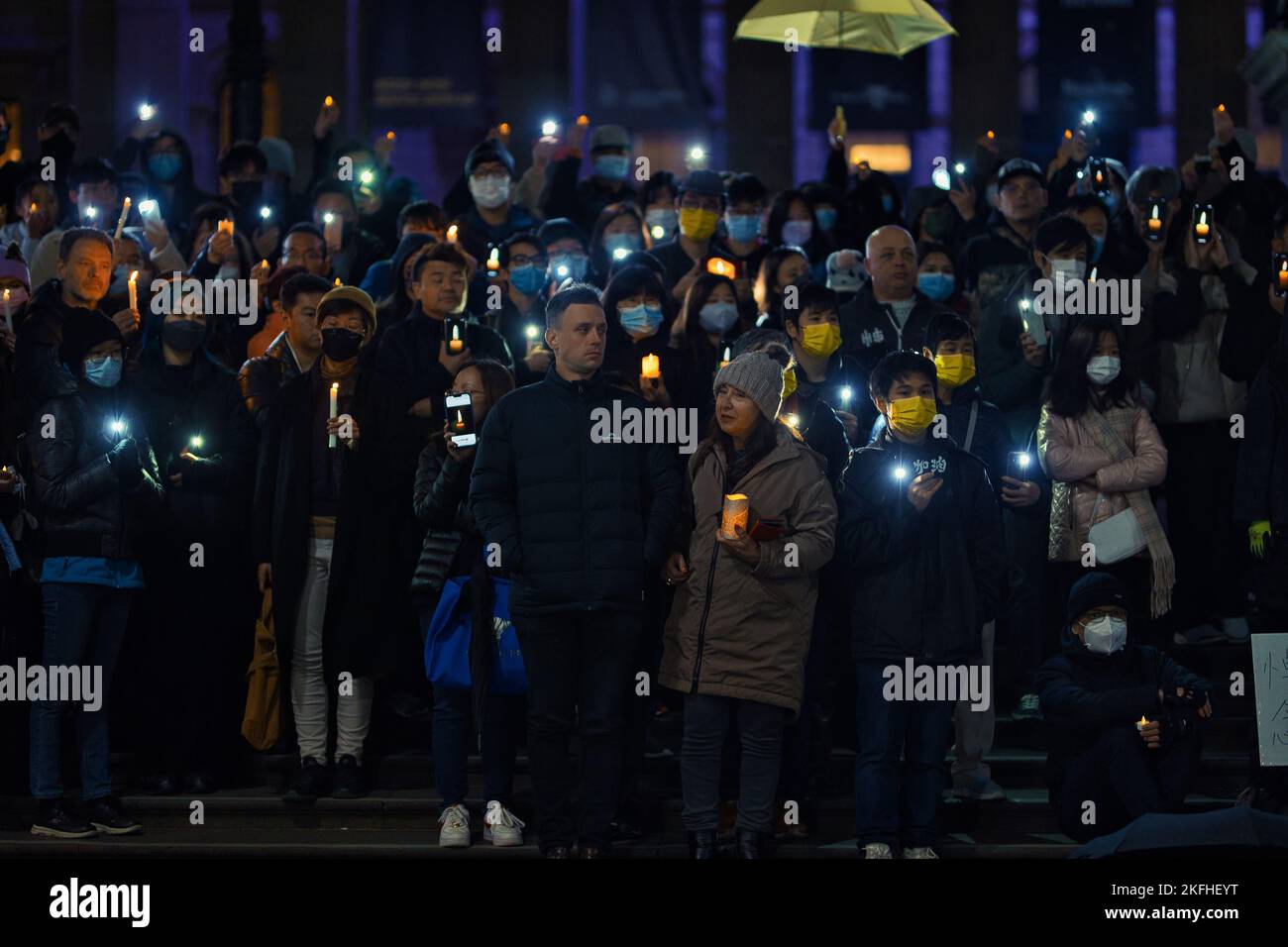A group of people lightening candles in the Tiananmen Square massacre ...