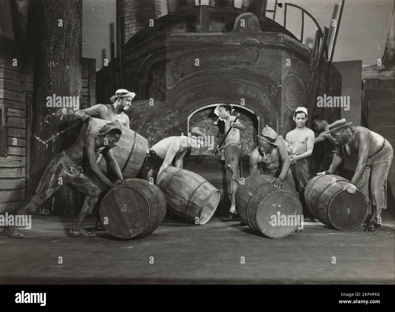 Men moving barrels, 1936 Stock Photo - Alamy