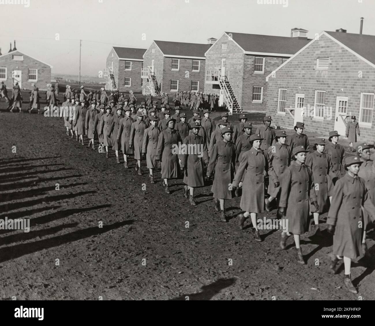 Members of an all-African American company walking in rows during an ...