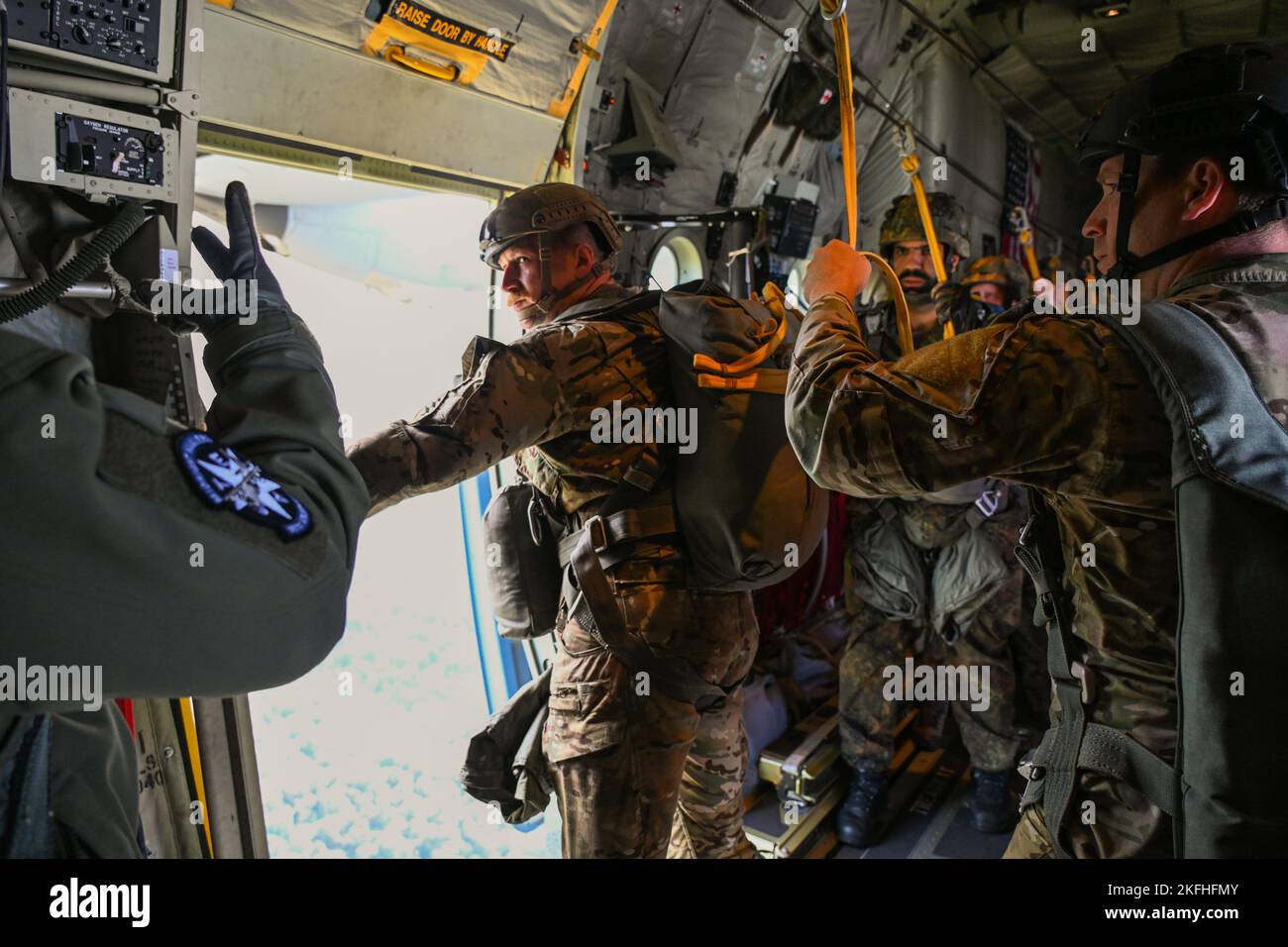 Army Airborne Paratroopers prepare to exit 136th Airlift Wings' C-130 J ...