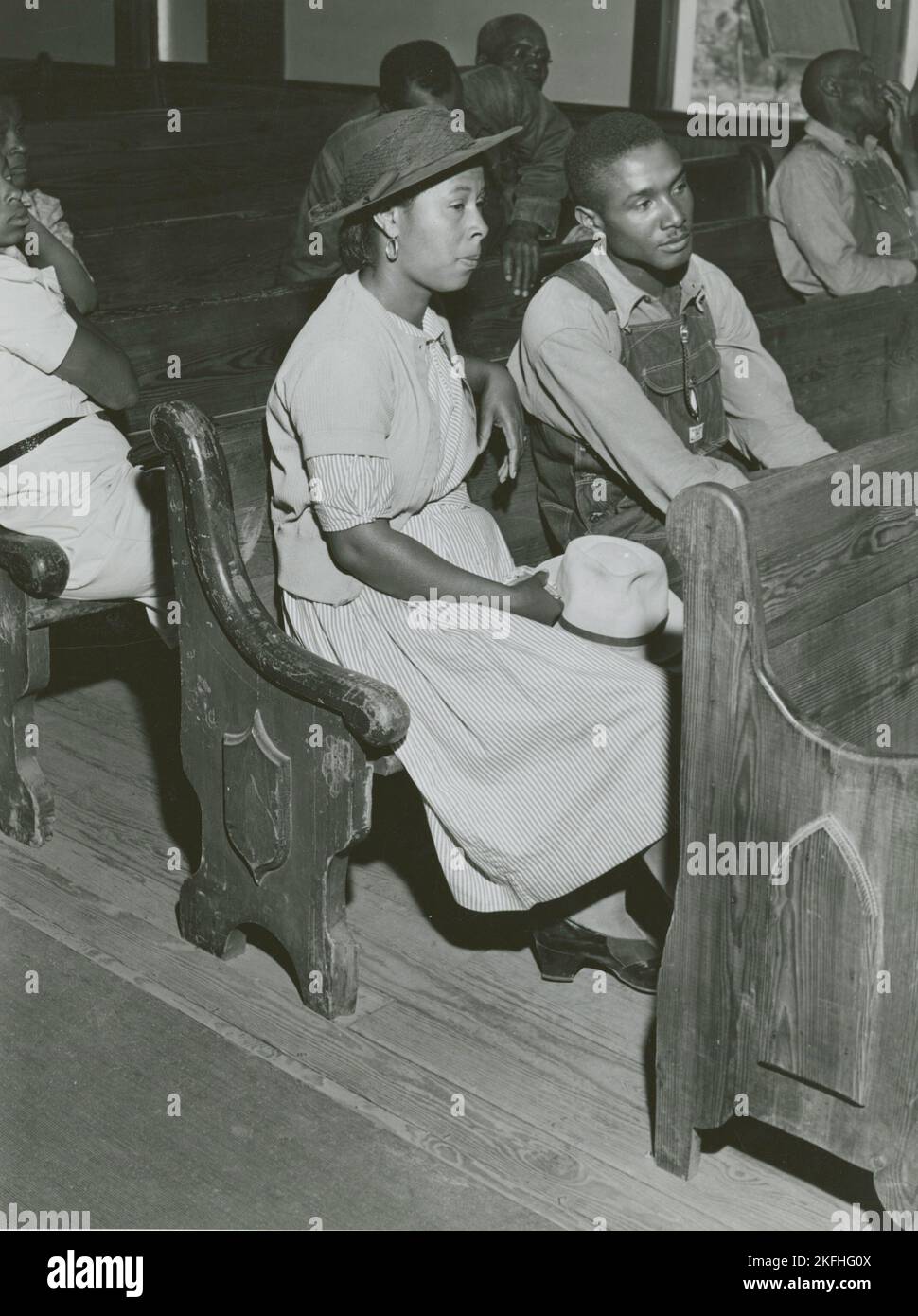 African Americans sitting in pews at a meeting of Farm Security ...
