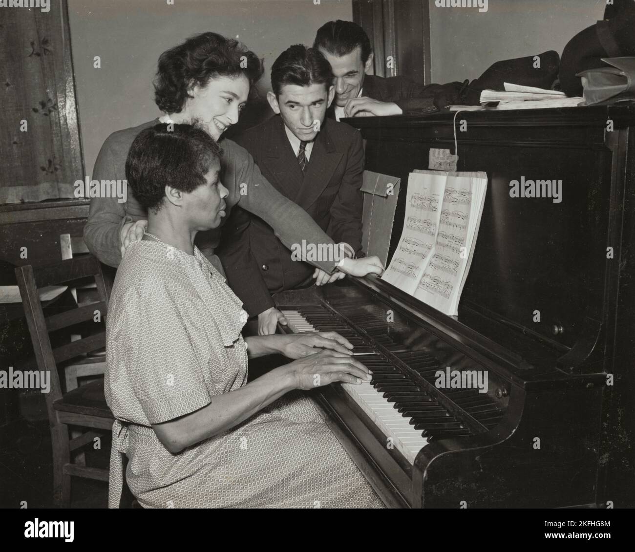 Teacher and student at piano, Jewish Settlement, 1938 Stock Photo - Alamy