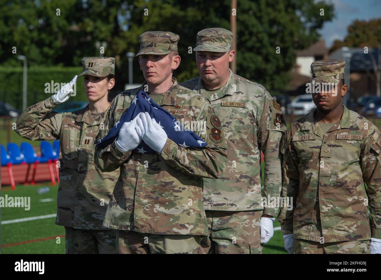 Liberty Wing Airmen salute a flight of volunteers after the flag ...