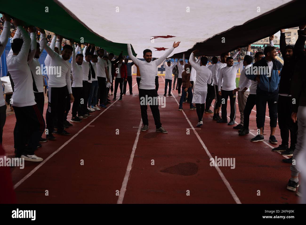 Idlib, Syria. 18th Nov, 2022. People hold a giant flag during the ...