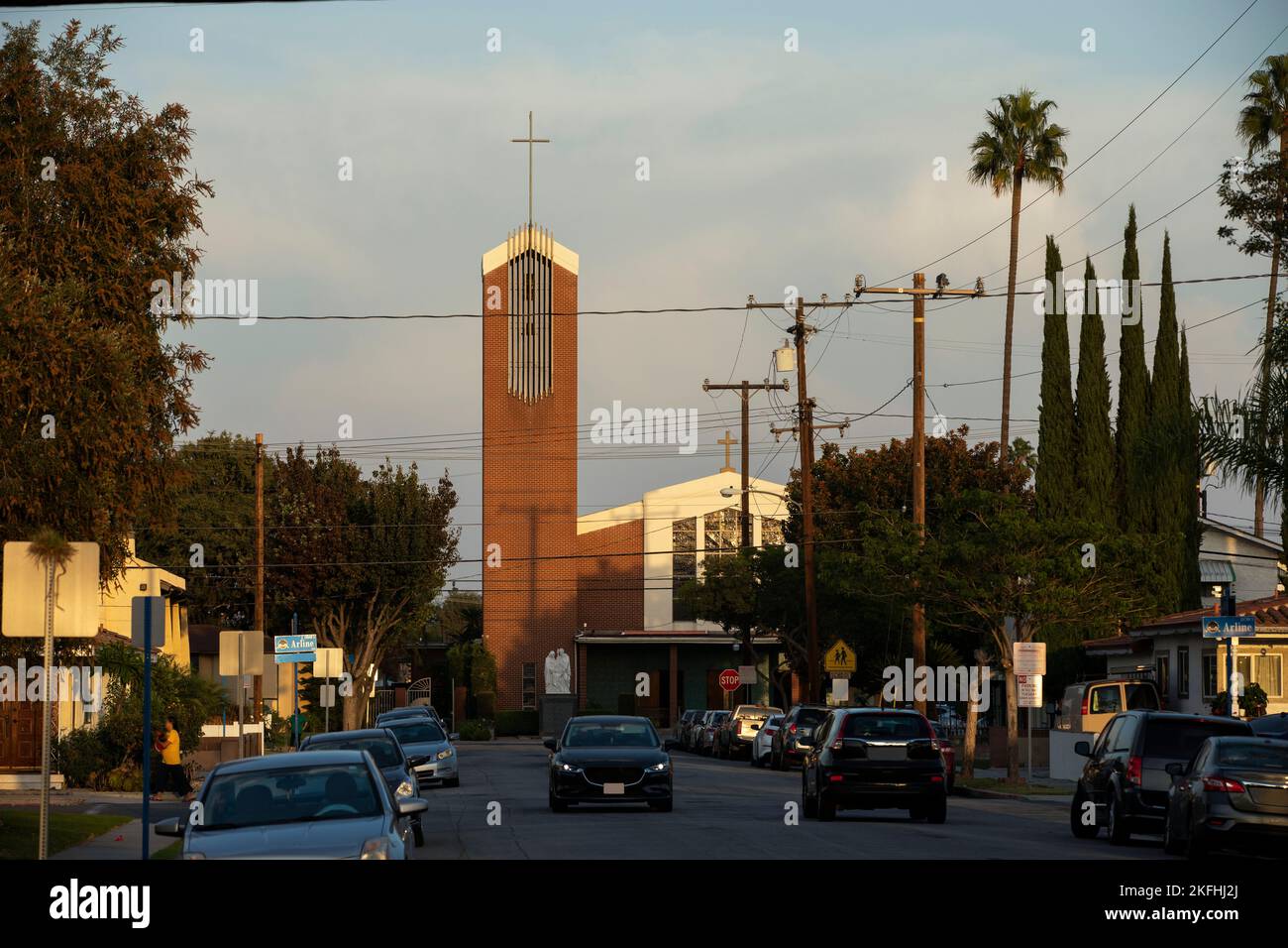 Sunset illuminates a church in a downtown neighborhood of Artesia ...