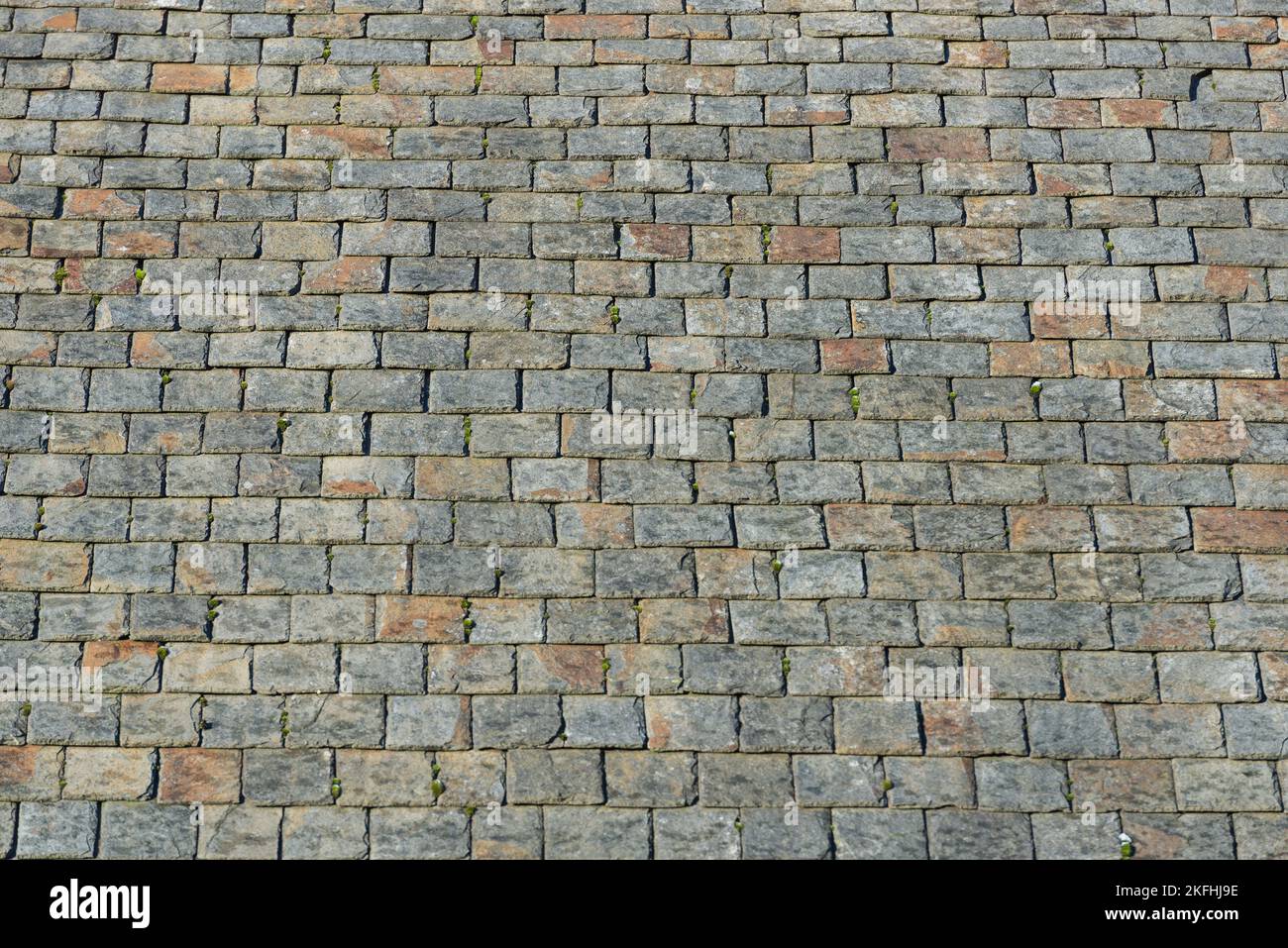 Coloured old stone tiled roof. textured backdrop Stock Photo - Alamy