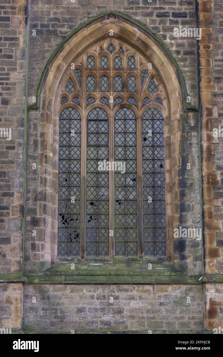 Window of an old derelict historical church. Ornate stone surround and ...