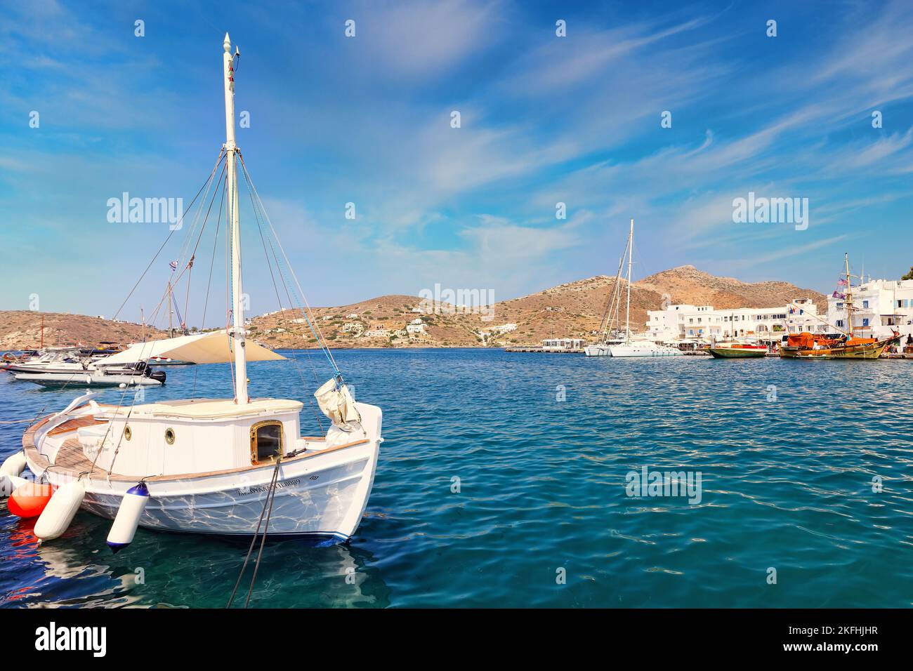 Boats at the picturesque port of Ios island, Greece Stock Photo - Alamy