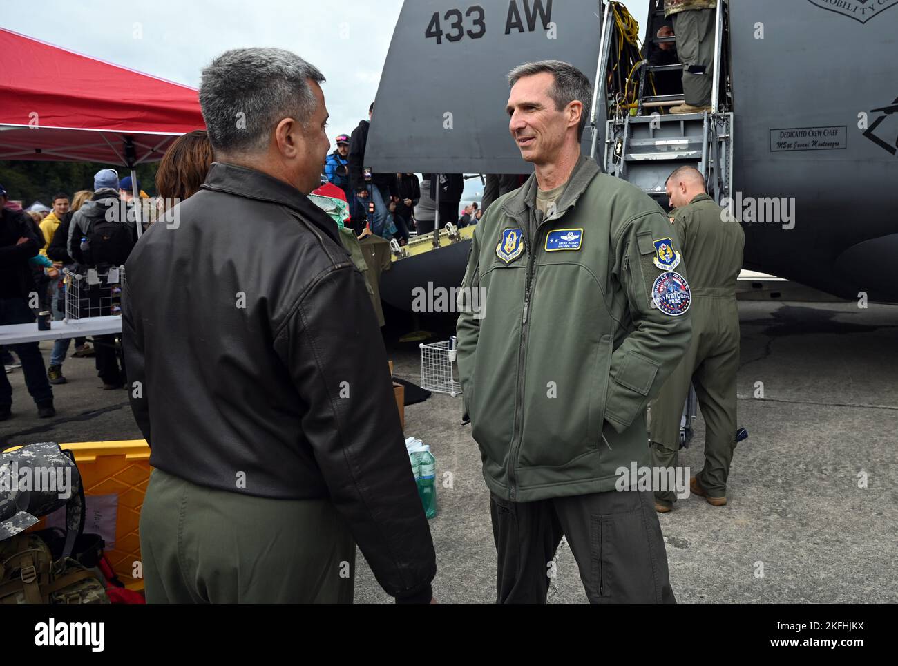 Maj. Gen. Bryan Radliff, 10th Air Force commander, talks with a 68th ...