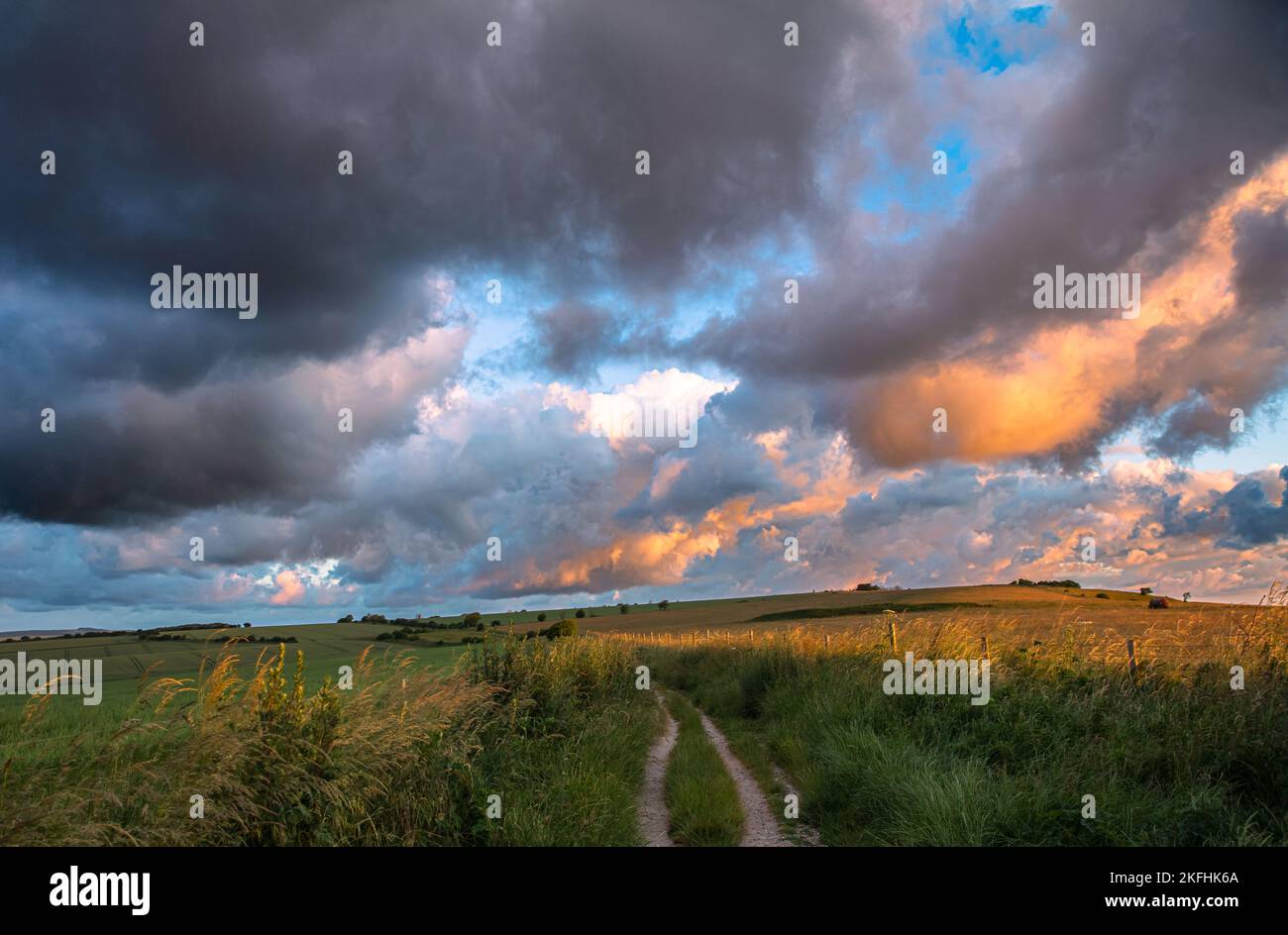 The dark clouds over a rural field Stock Photo - Alamy