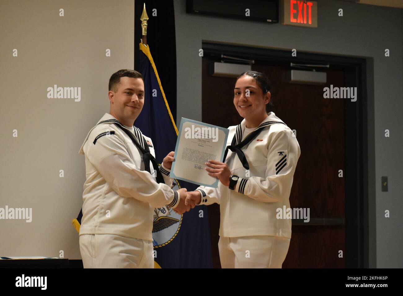 U.S. Navy FTSN Casey Lopez receives the award for Distinguished Honor ...