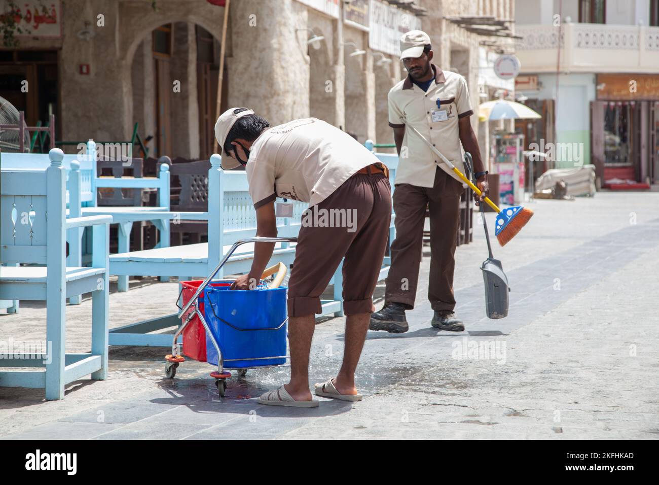 Doha, Qatar, December 18,2019 : Street cleaners clean the old market ...