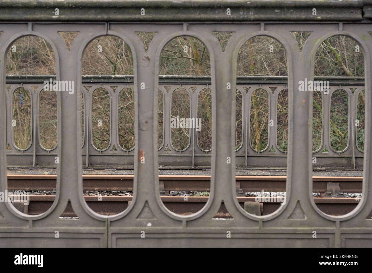 Metal railway bridge with oval openings. Patterned background with ...