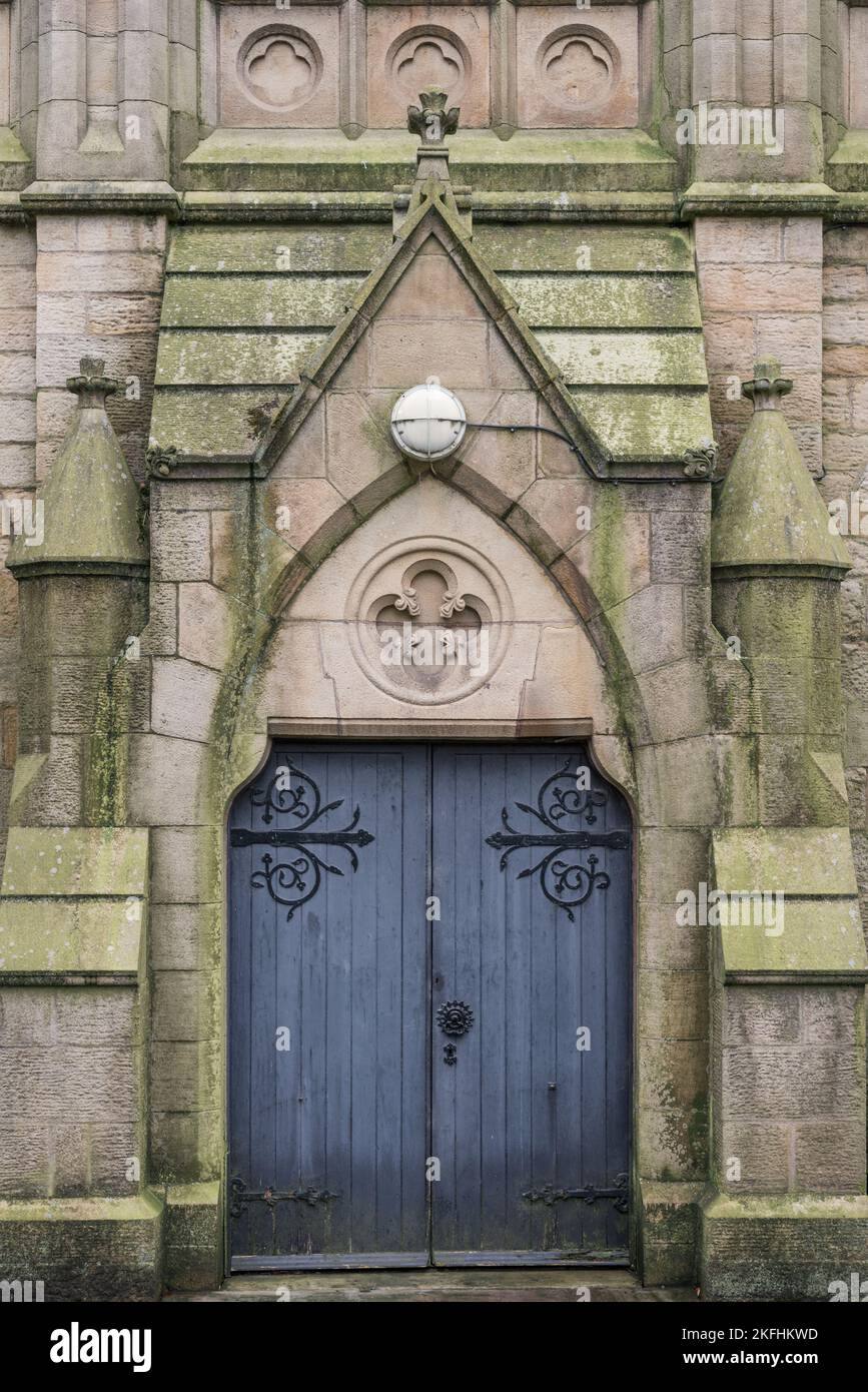 Church doorway. Blue wooden rustic door with black artistic hinges ...