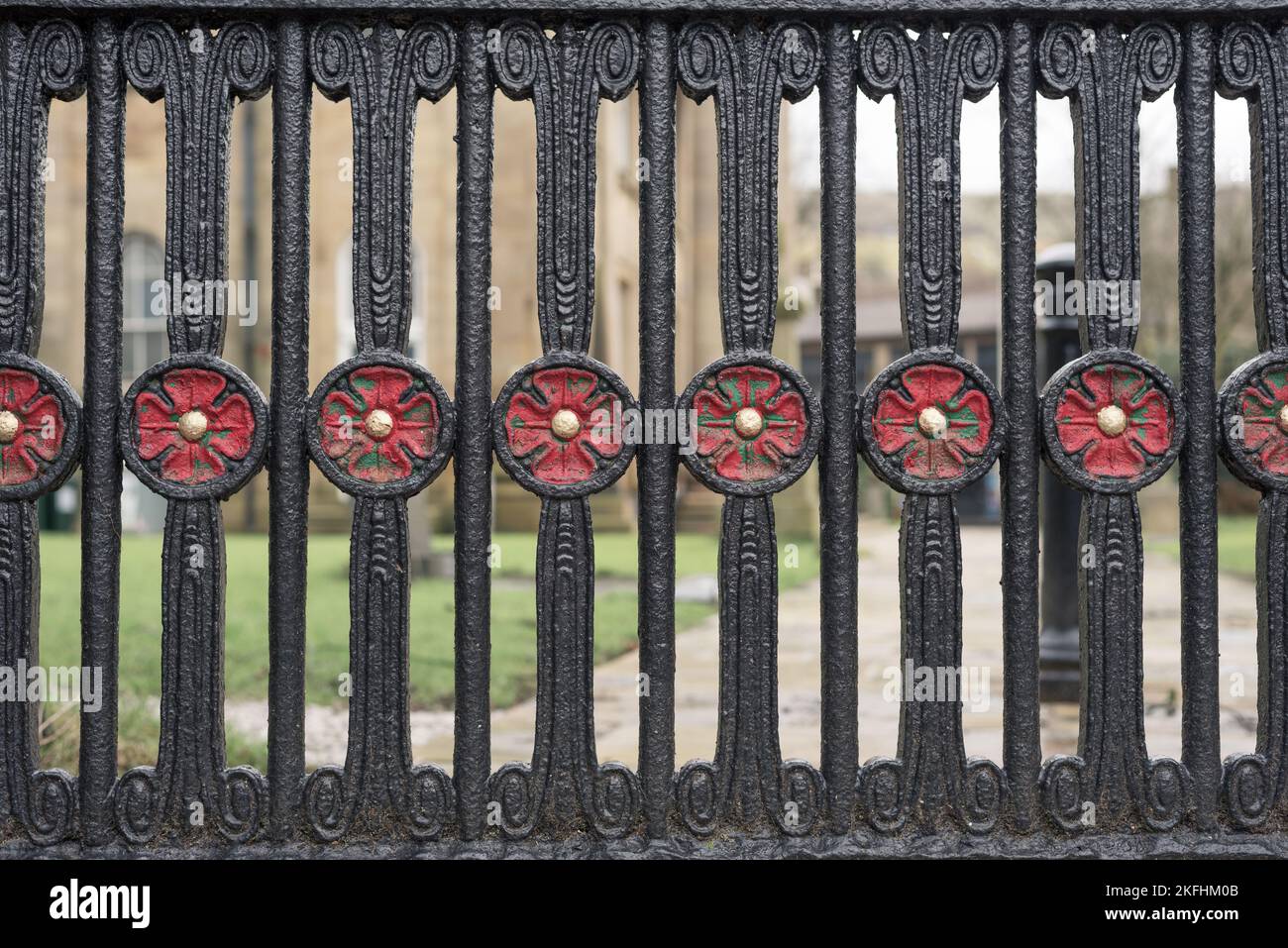 Fancy metal black patterned railings with red roses Stock Photo - Alamy