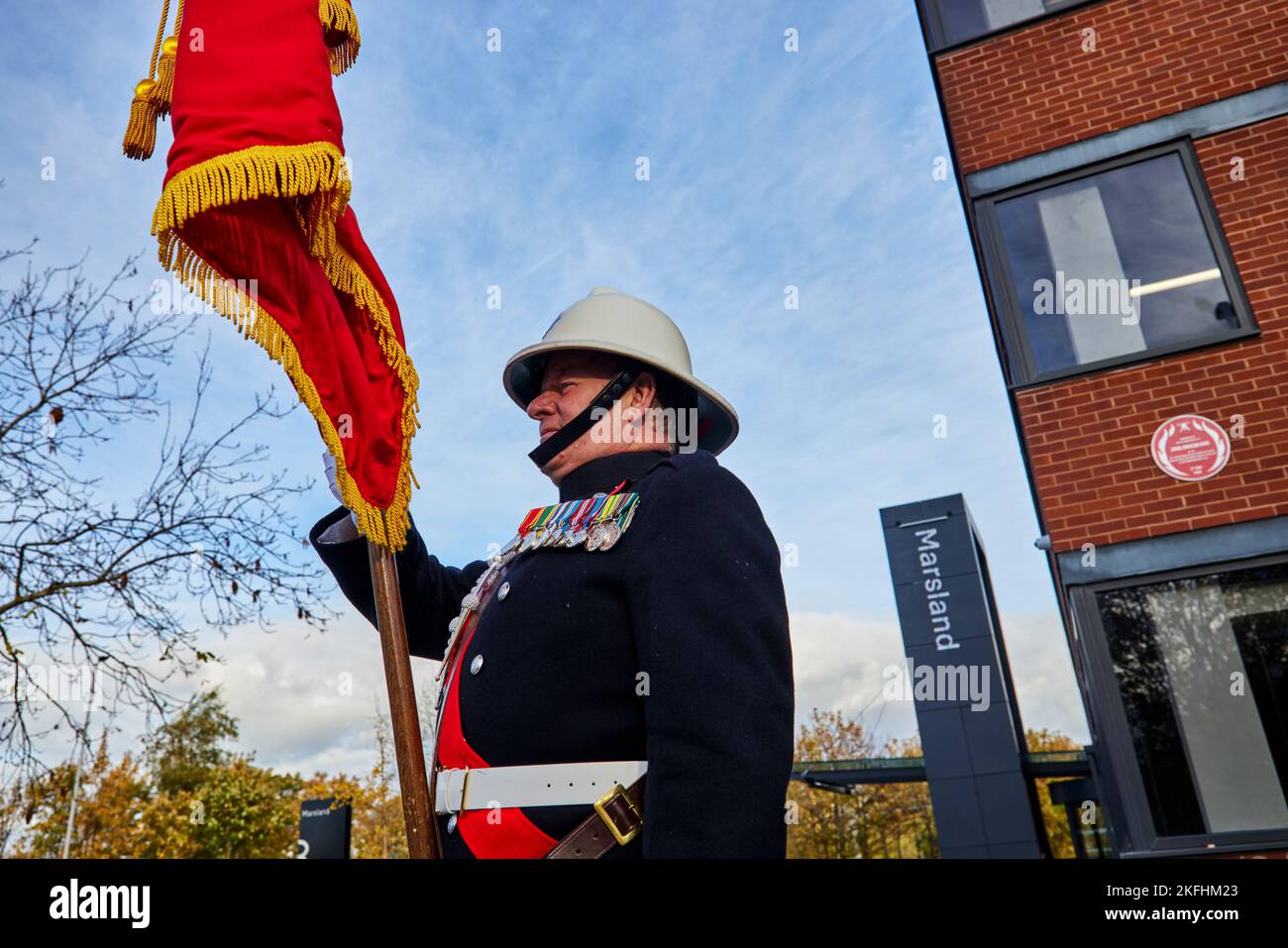 red plaque in memory of John Johnson Hunt who lost his life in service ...