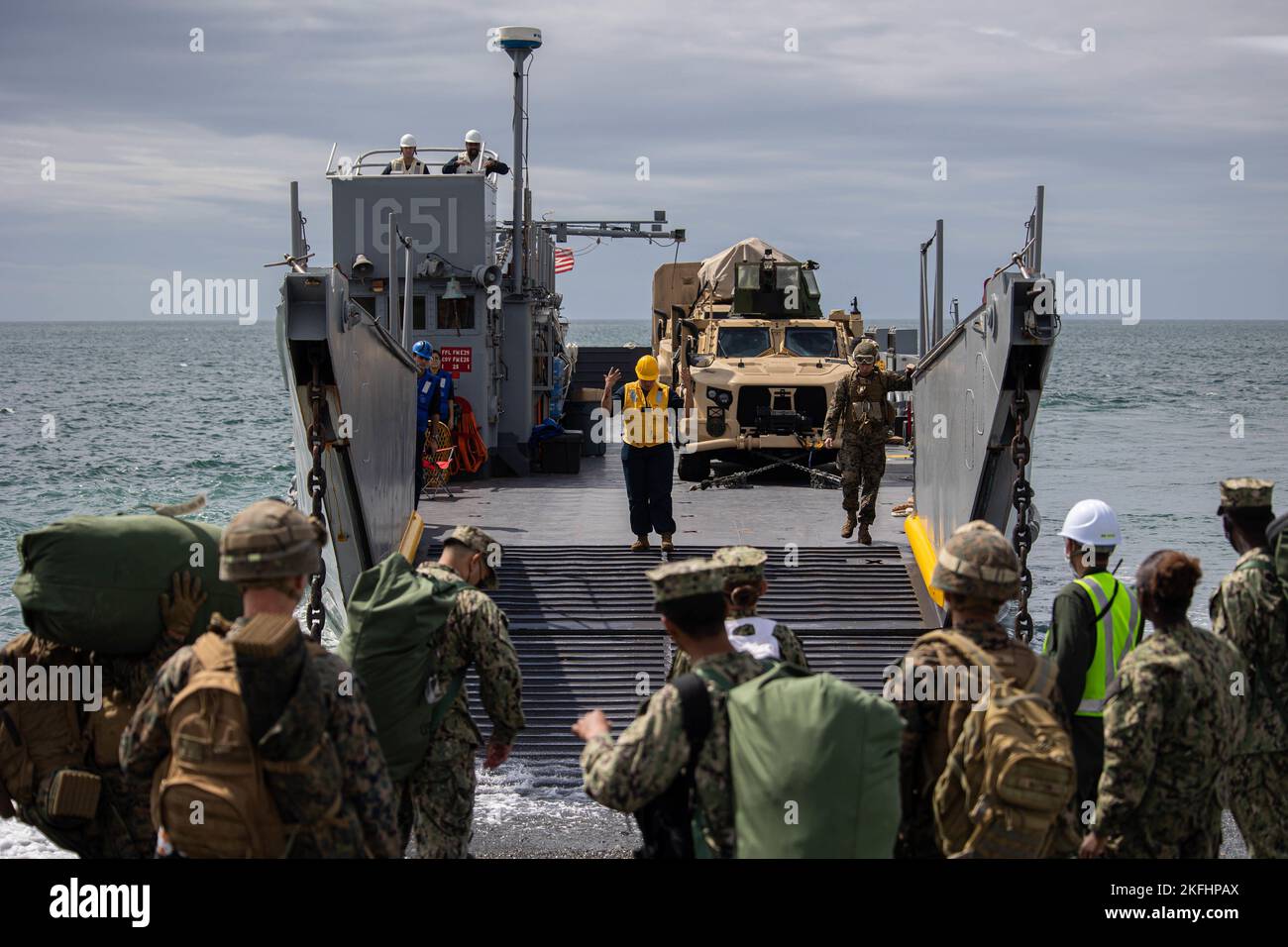 A U.S. Sailor assigned to Landing Craft Utility (LCU) 1651 with Naval ...