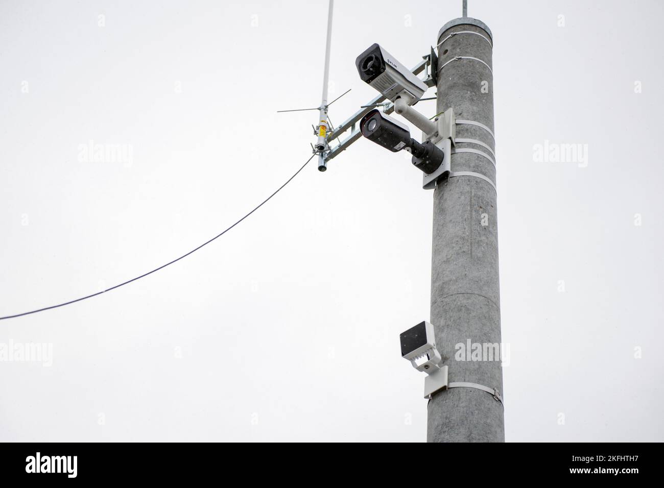 A view of the surveillance cameras on a pole of the electronic barrier ...