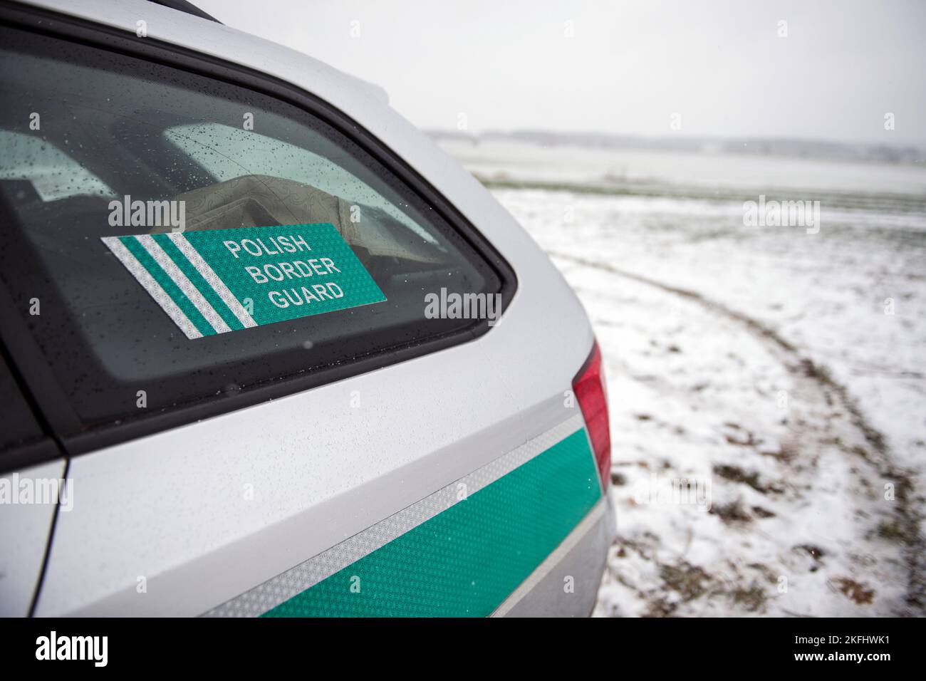 The side of the border guard patrol vehicle is seen next to the border ...