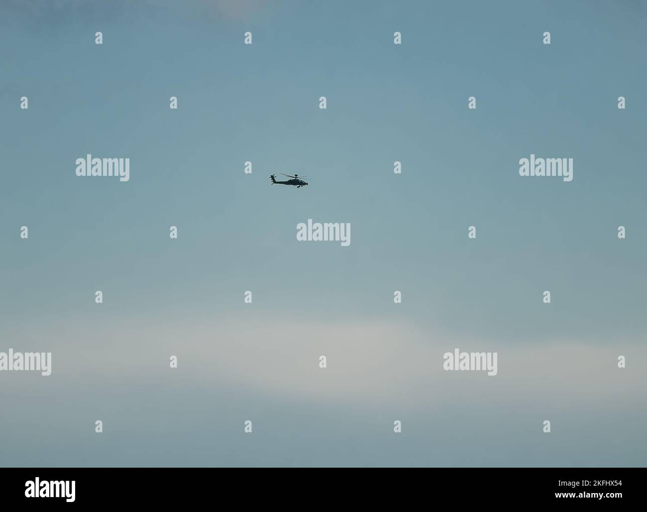 British army Apache AH64E helicopter gunship in autumn sky, Wilts UK ...