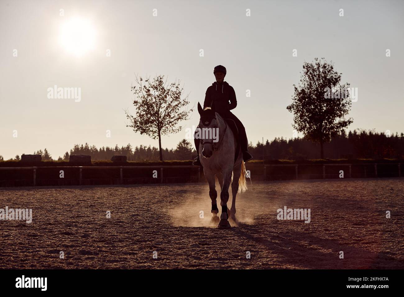 A young Caucasian girl riding a horse during the daytime Stock Photo ...