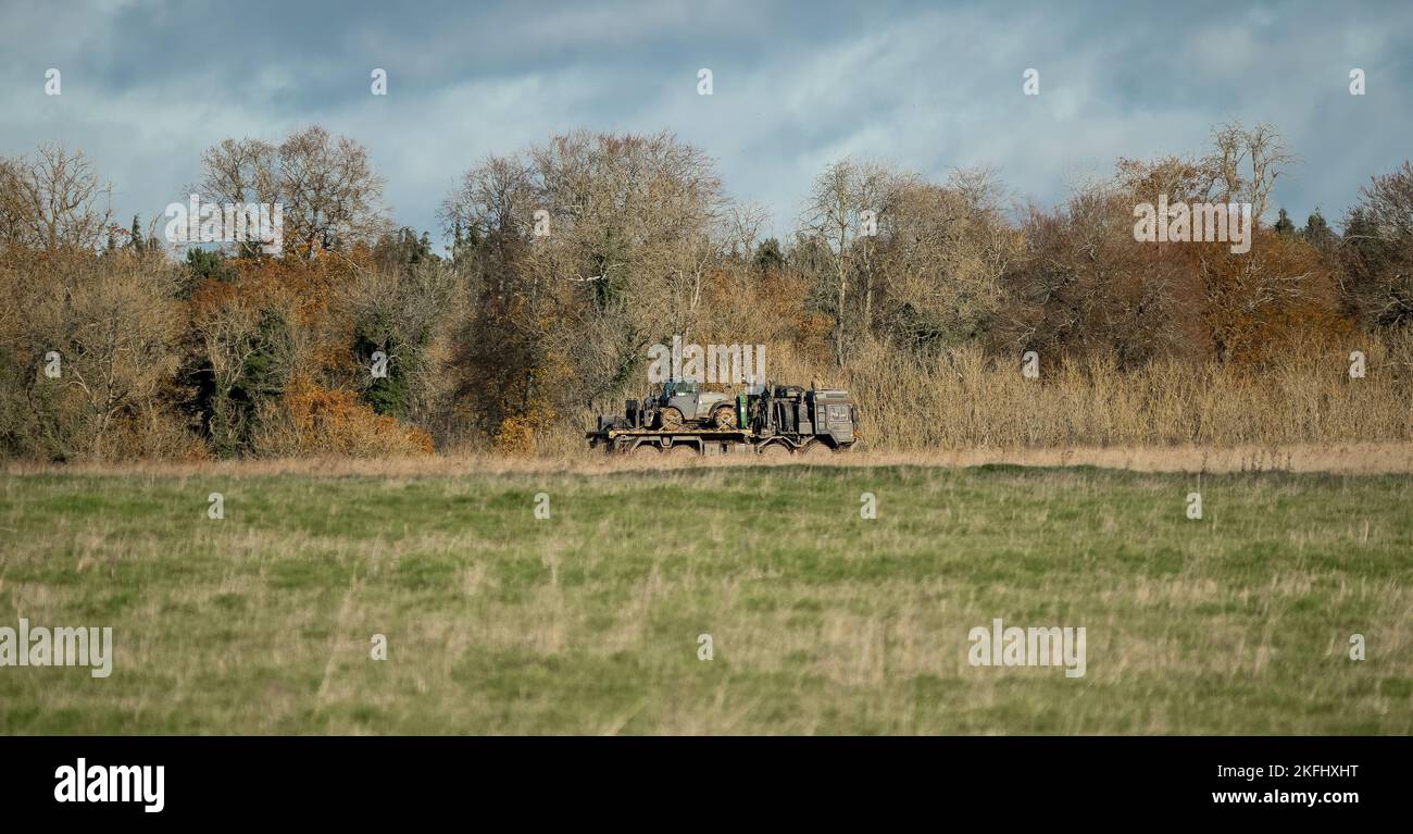 British army MAN HX77 8x8 logistics truck with armed rooftop soldier in ...