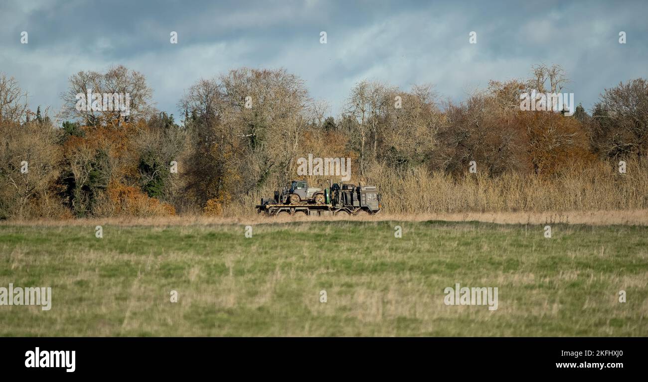 British army MAN HX77 8x8 logistics truck with armed rooftop soldier in ...