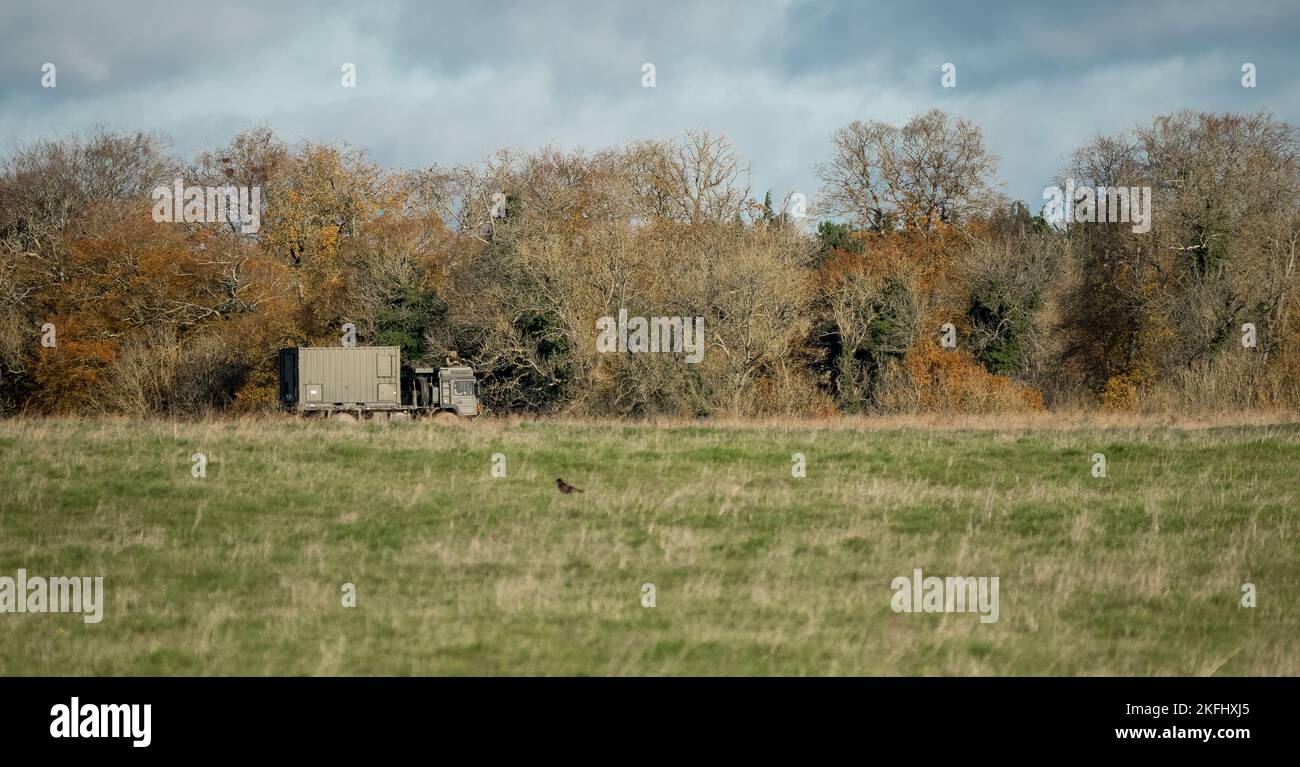 British army MAN SV 4x4 logistics truck with armed rooftop soldier in ...