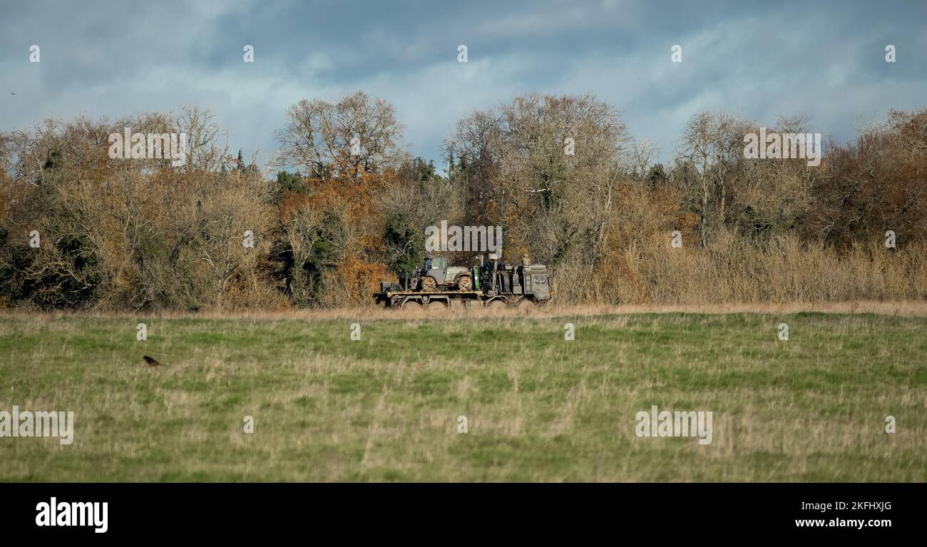 British army MAN HX77 8x8 logistics truck with armed rooftop soldier in ...