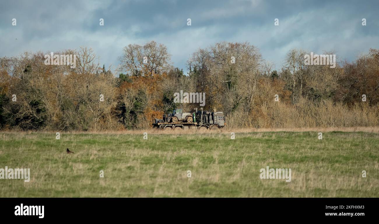 British army MAN HX77 8x8 logistics truck with armed rooftop soldier in ...
