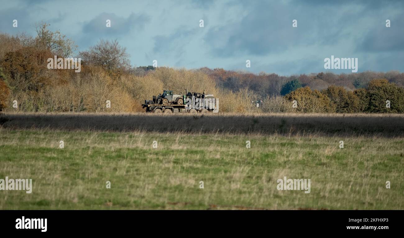 British army MAN HX77 8x8 logistics truck with armed rooftop soldier in ...