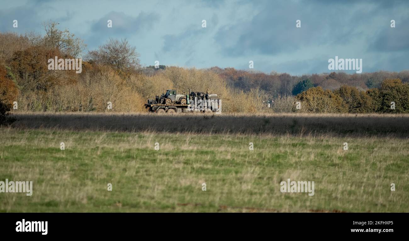British army MAN HX77 8x8 logistics truck with armed rooftop soldier in ...