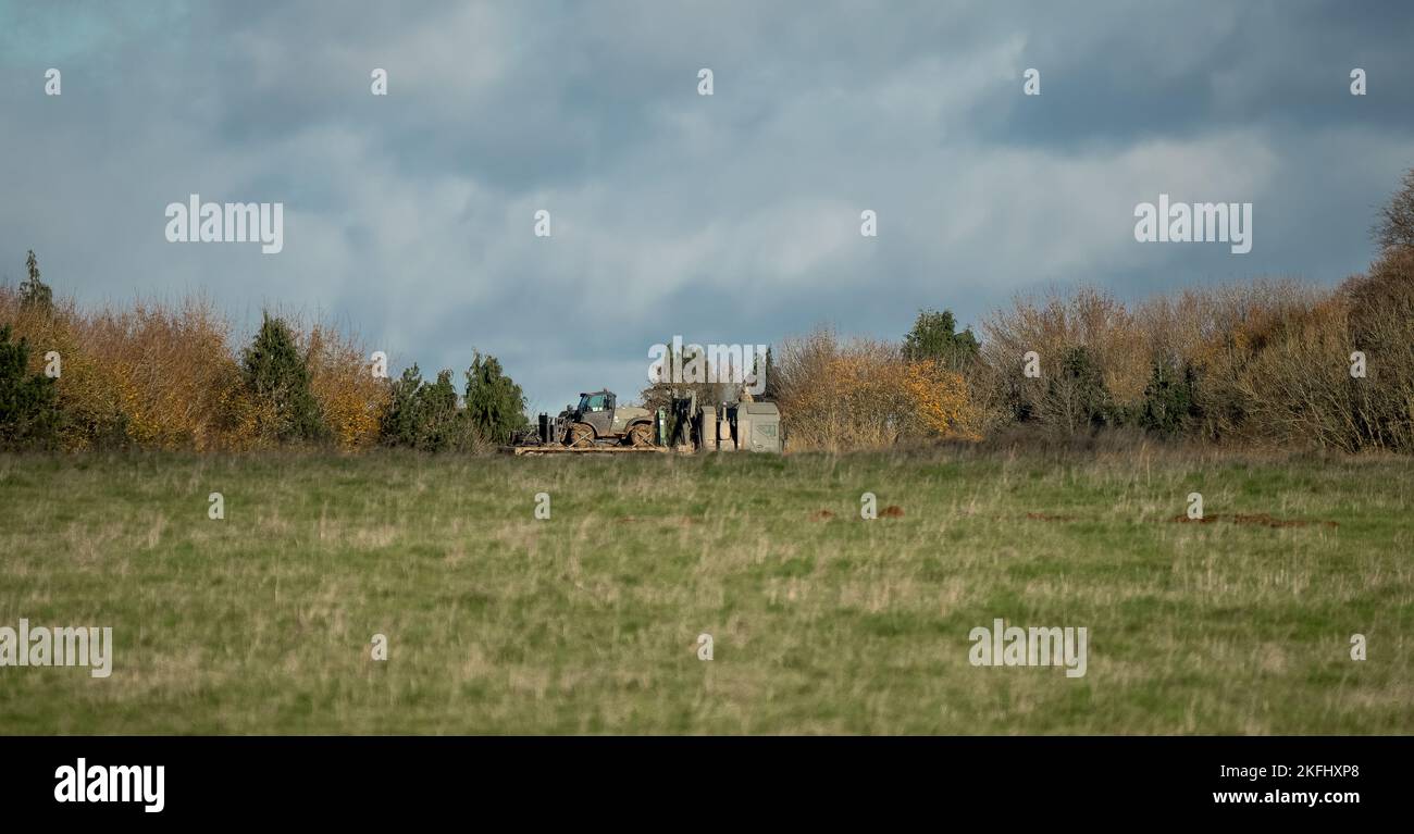 British army MAN HX77 8x8 logistics truck with armed rooftop soldier in ...