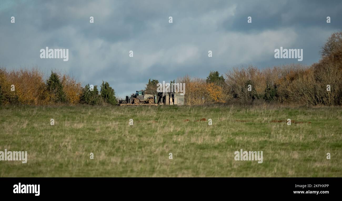 British army MAN HX77 8x8 logistics truck with armed rooftop soldier in ...