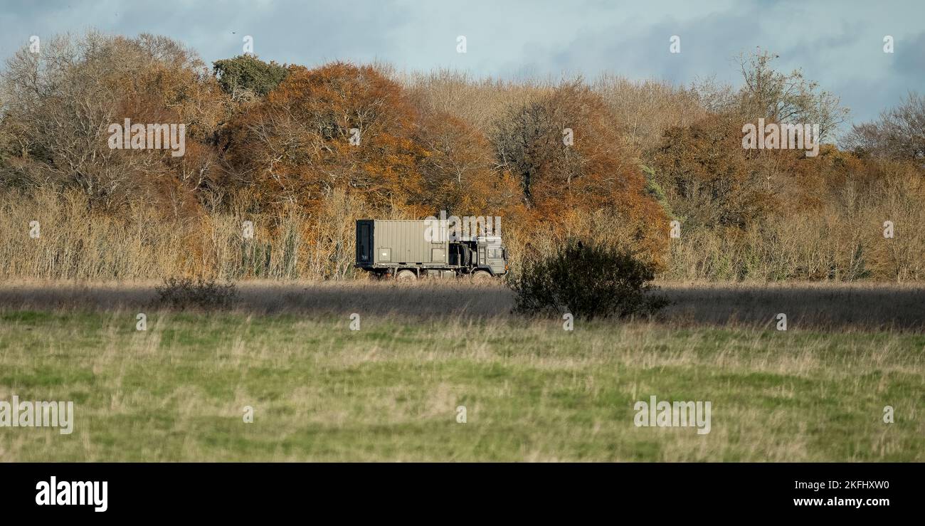 British army MAN SV 4x4 logistics truck with armed rooftop soldier in ...