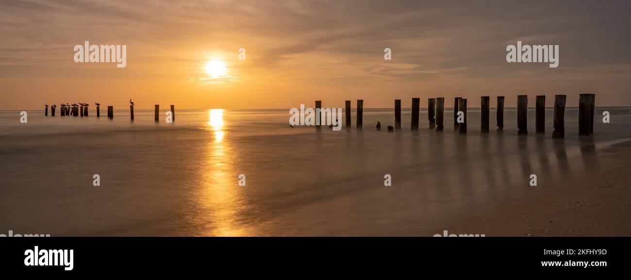 A panoramic shot of the Pier Naples in Florida with a scenic sunset ...