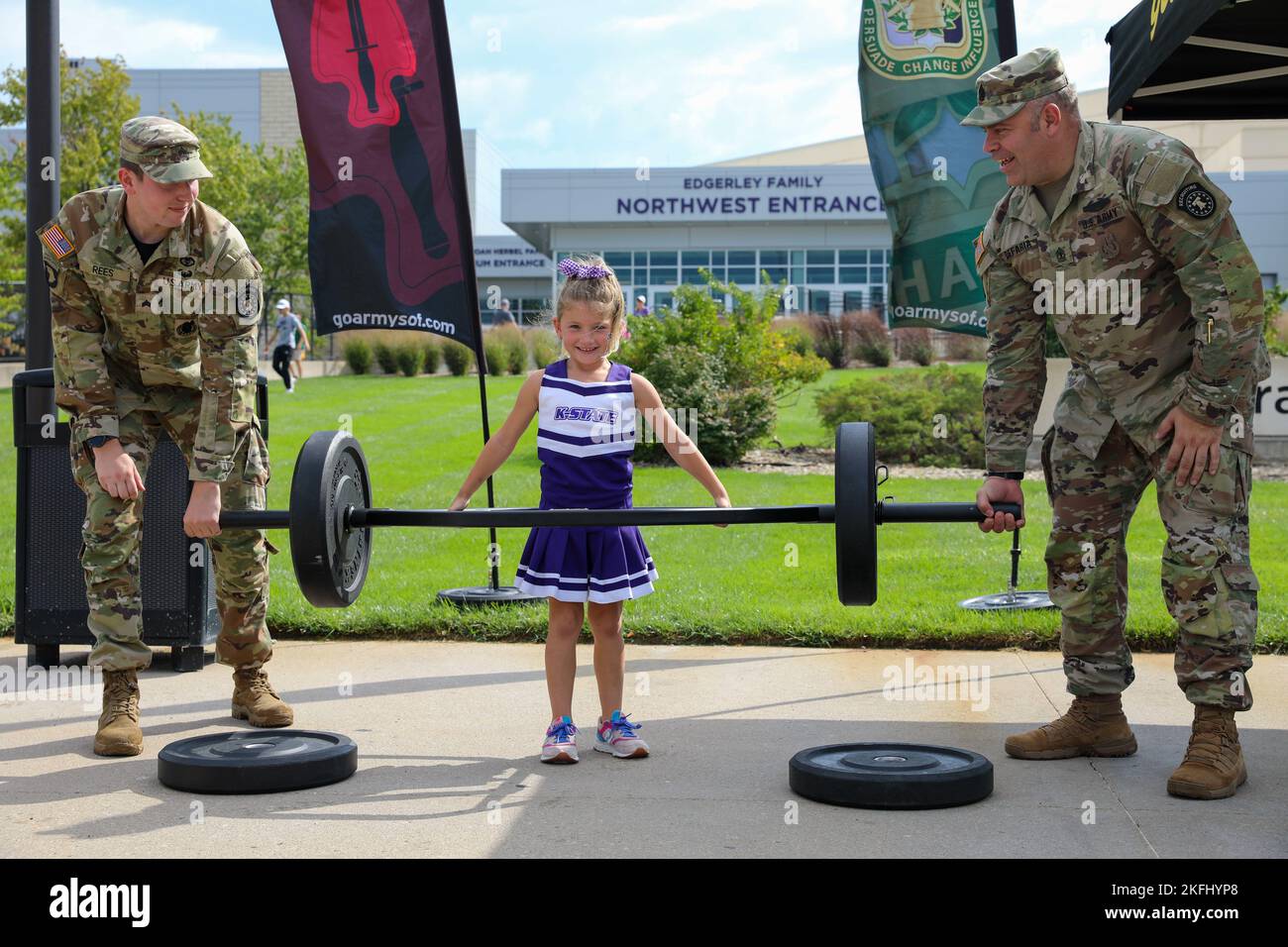 U.S. Army Soldiers engage with community members in front of static ...