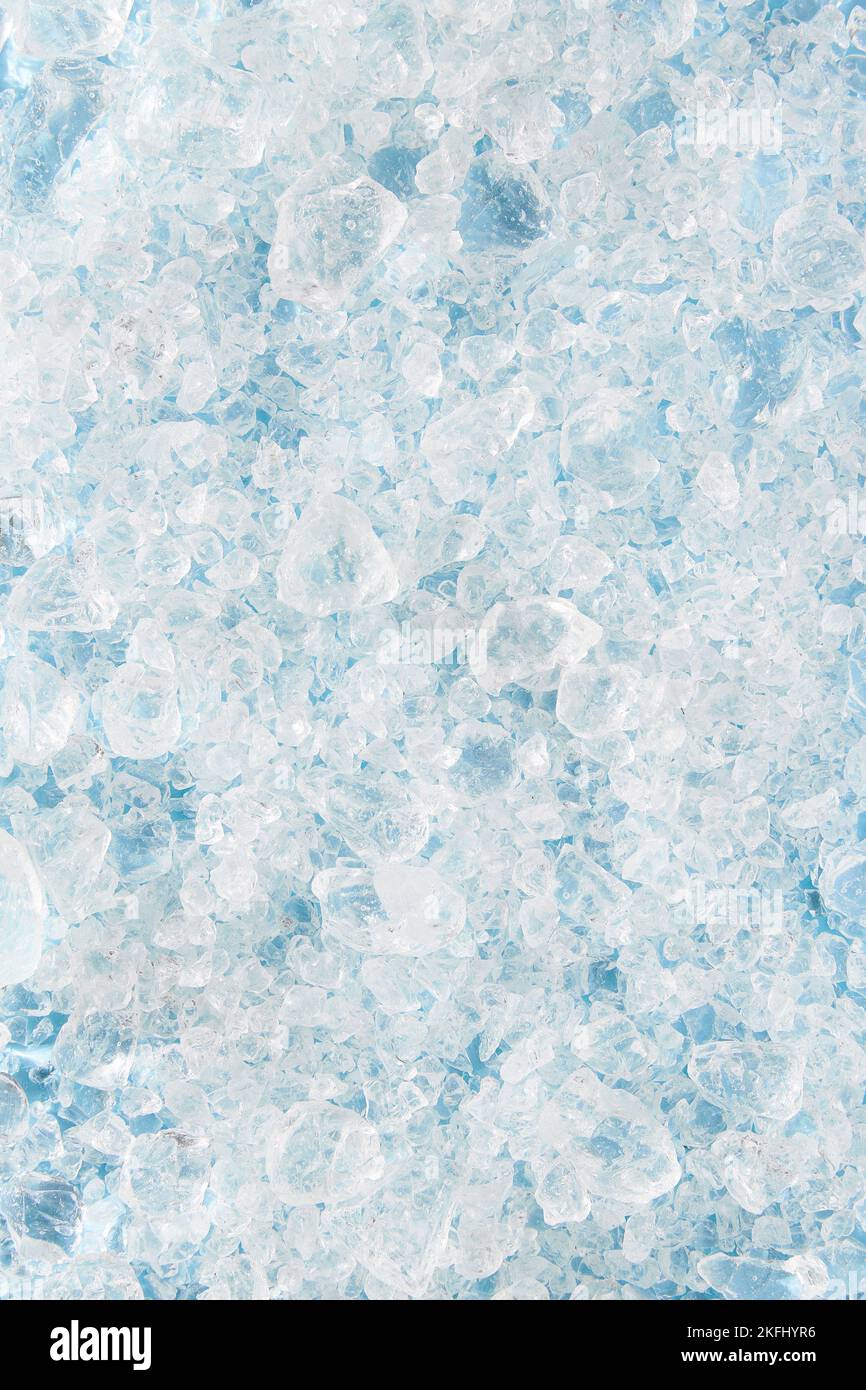 Close up crushed ice in sunlight. Summer pattern background refreshment ...