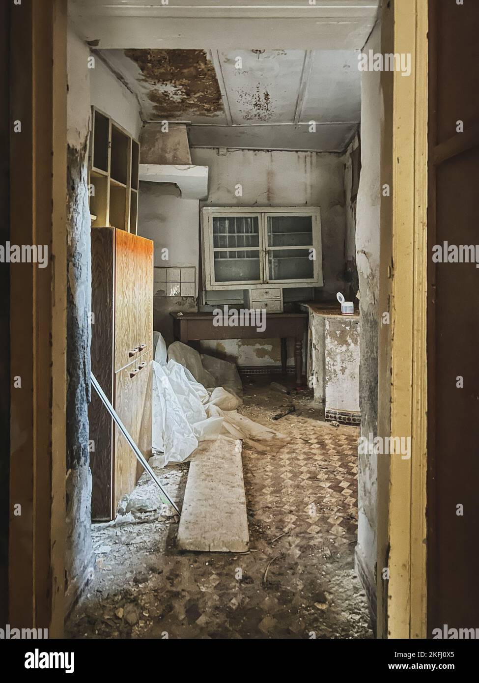 Interior of abandoned home with old furniture and bad conditioned rooms ...