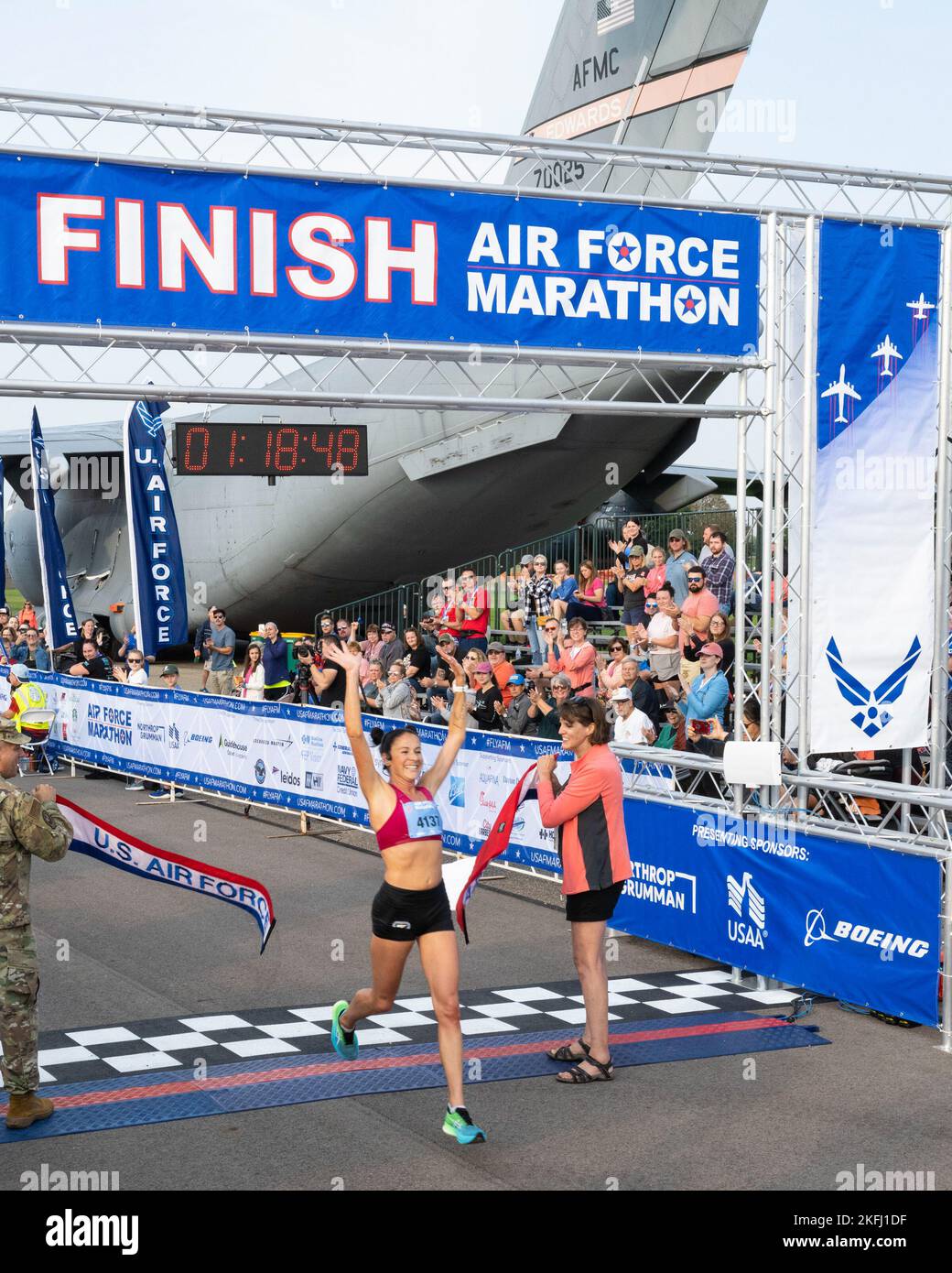 Rebecca Murray crosses the finish line of the 10K race during the 2022 ...