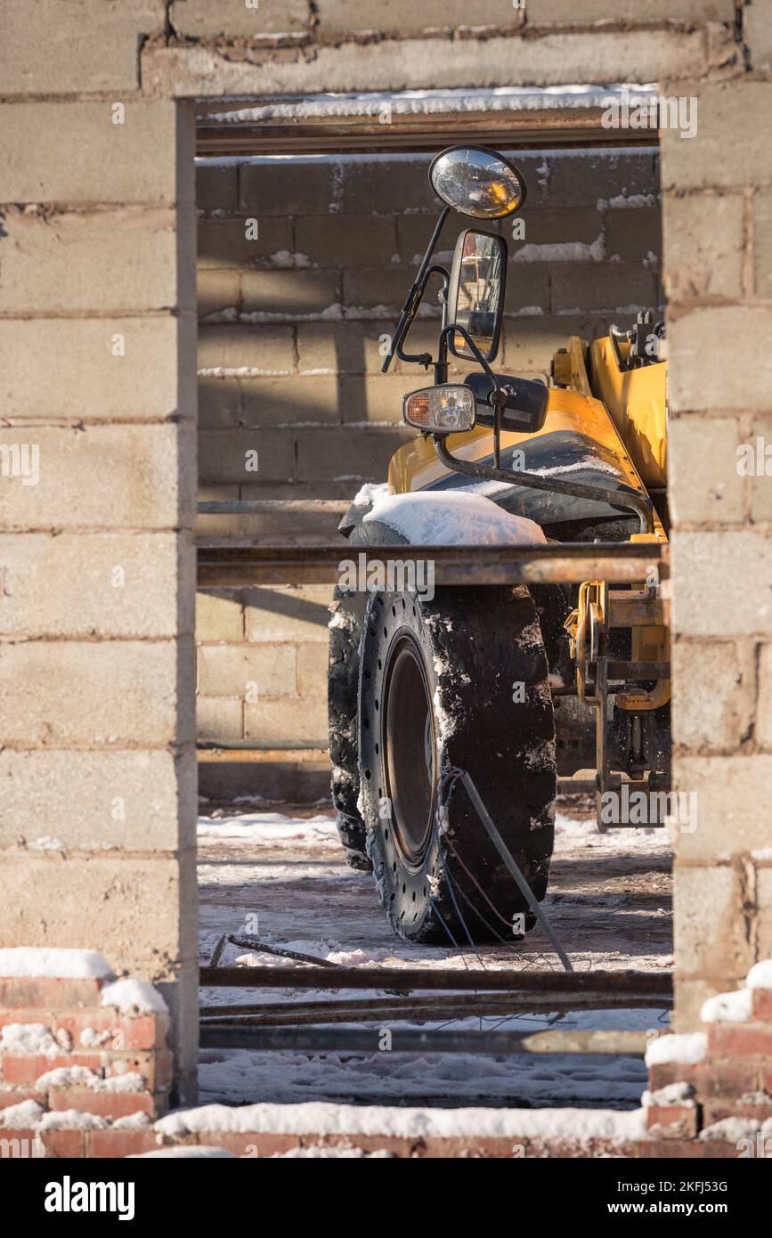 Doorway on building site with rusty building machinery in the building ...