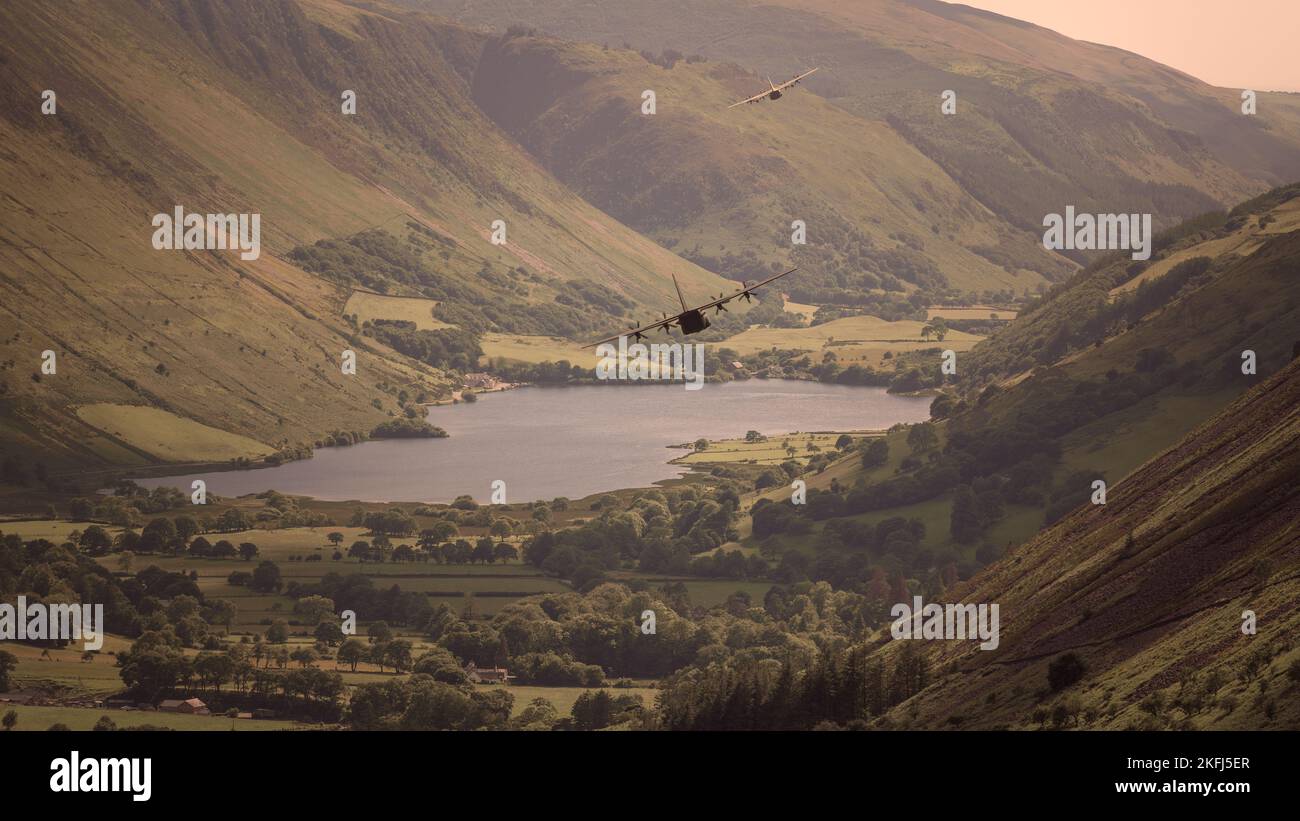Two military transport aeroplanes flying low level in the UK low fly ...