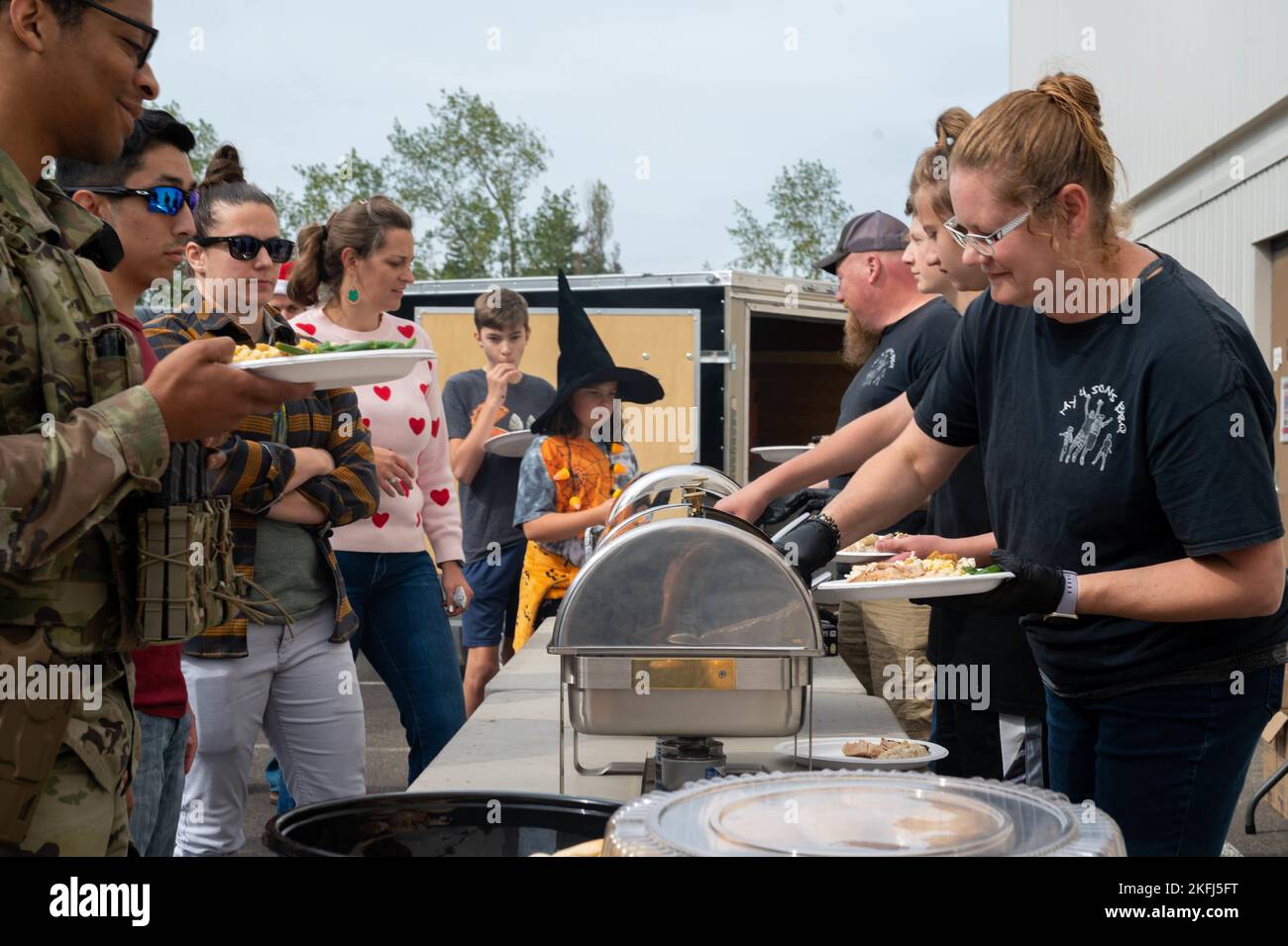 Team McChord Airmen and families receive a Thanksgiving dinner during a ...